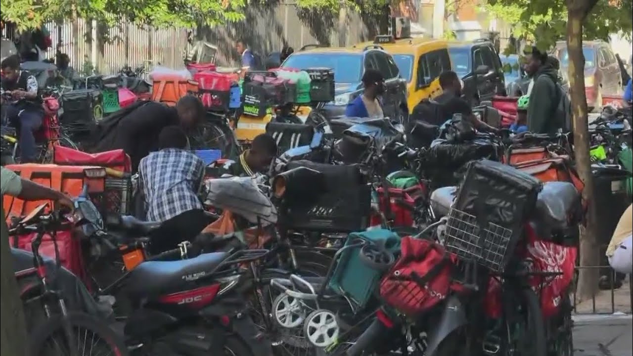 Unofficial E-bike parking hub stirs debate in East Village - YouTube
