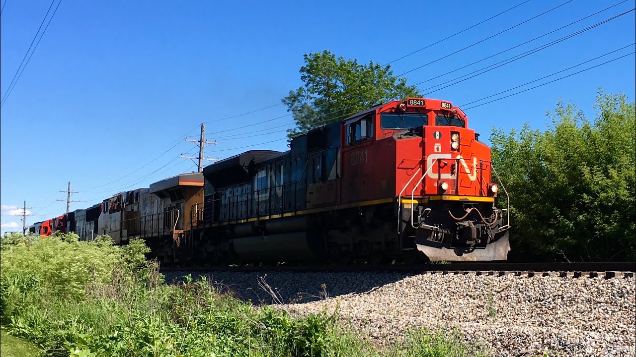 CN 8841 leads CN M337 with a GTW SD40-2 through Glendale Heights, IL on 6/5/2024. - YouTube