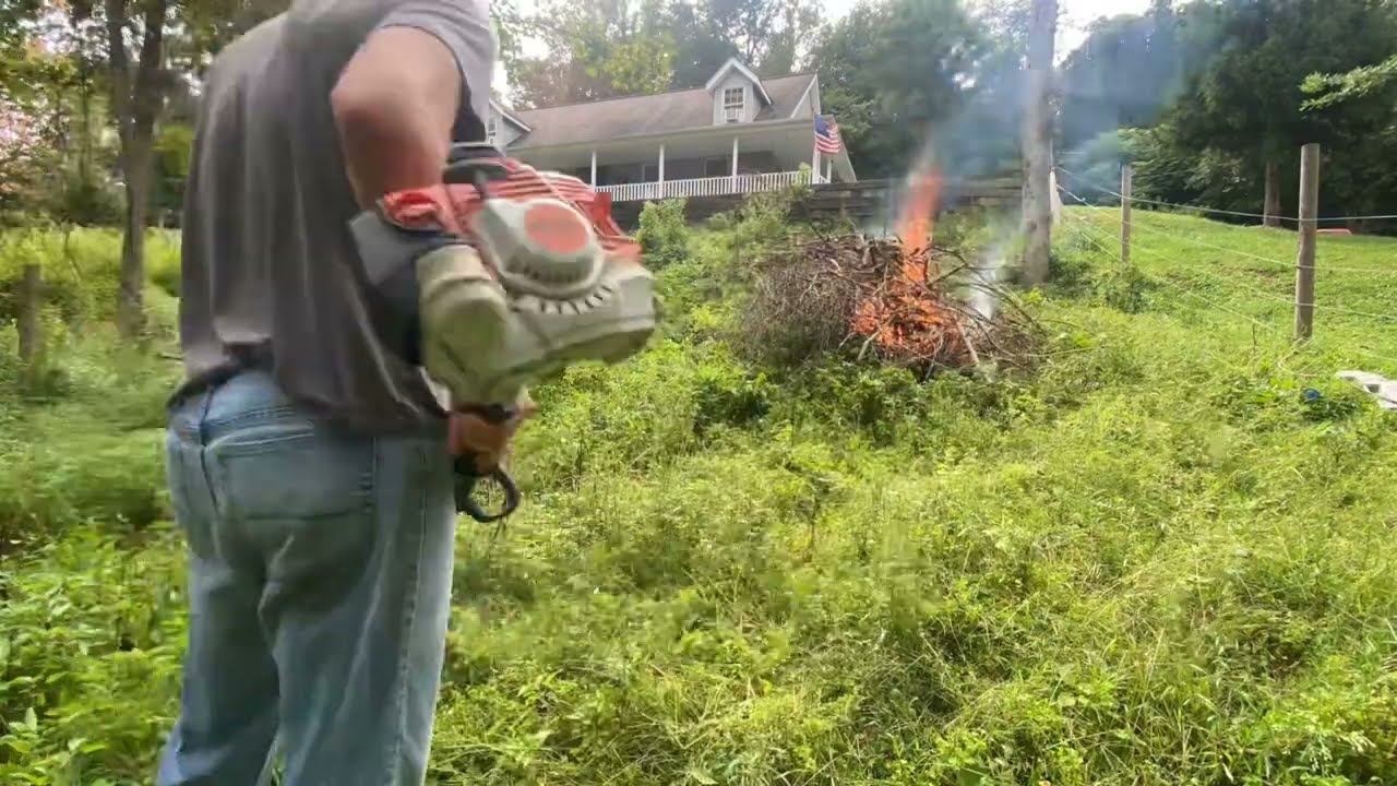 Stihl FS 94R trimmer clearing a steep overgrown bank. - YouTube