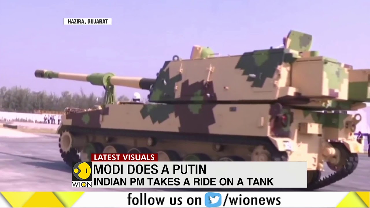 PM Modi takes a tank ride in Surat - YouTube