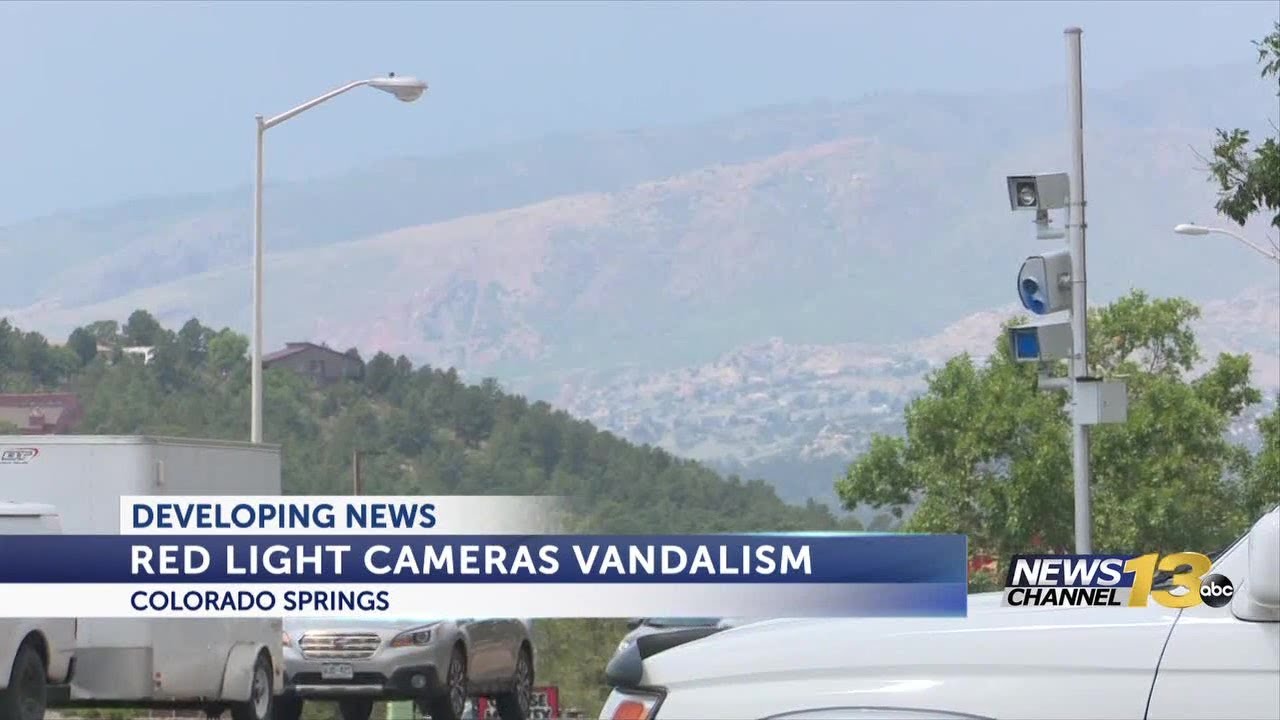 Red light cameras in Colorado Springs covered with paint - YouTube