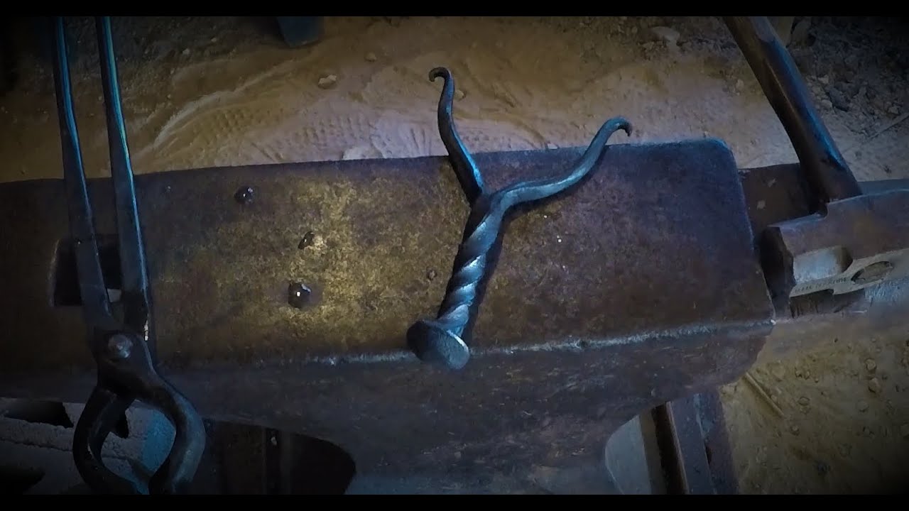 Railroad spike slingshot beginner blacksmith project final - YouTube