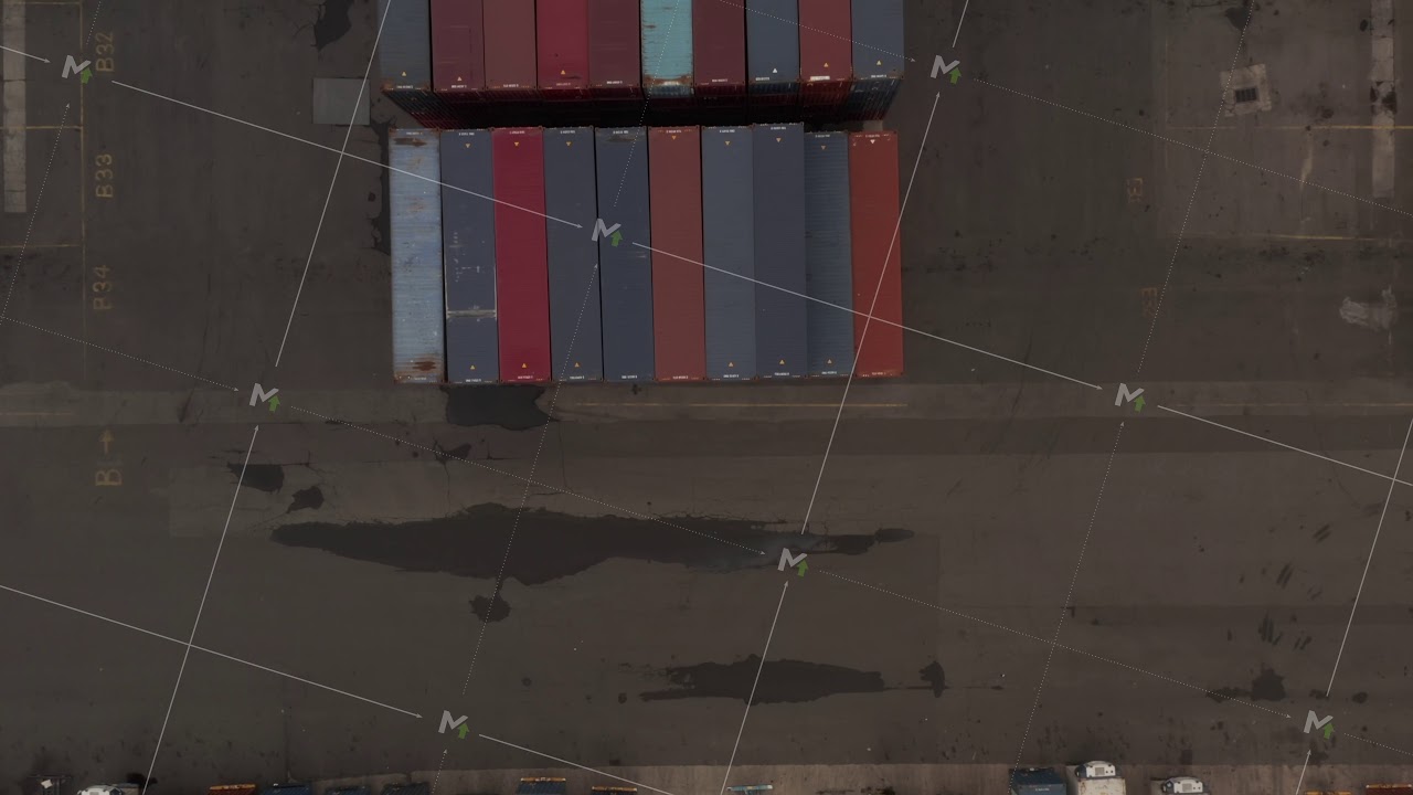 AERIAL: Birds Eye View of Red and Blue industrial cargo containers in ...
