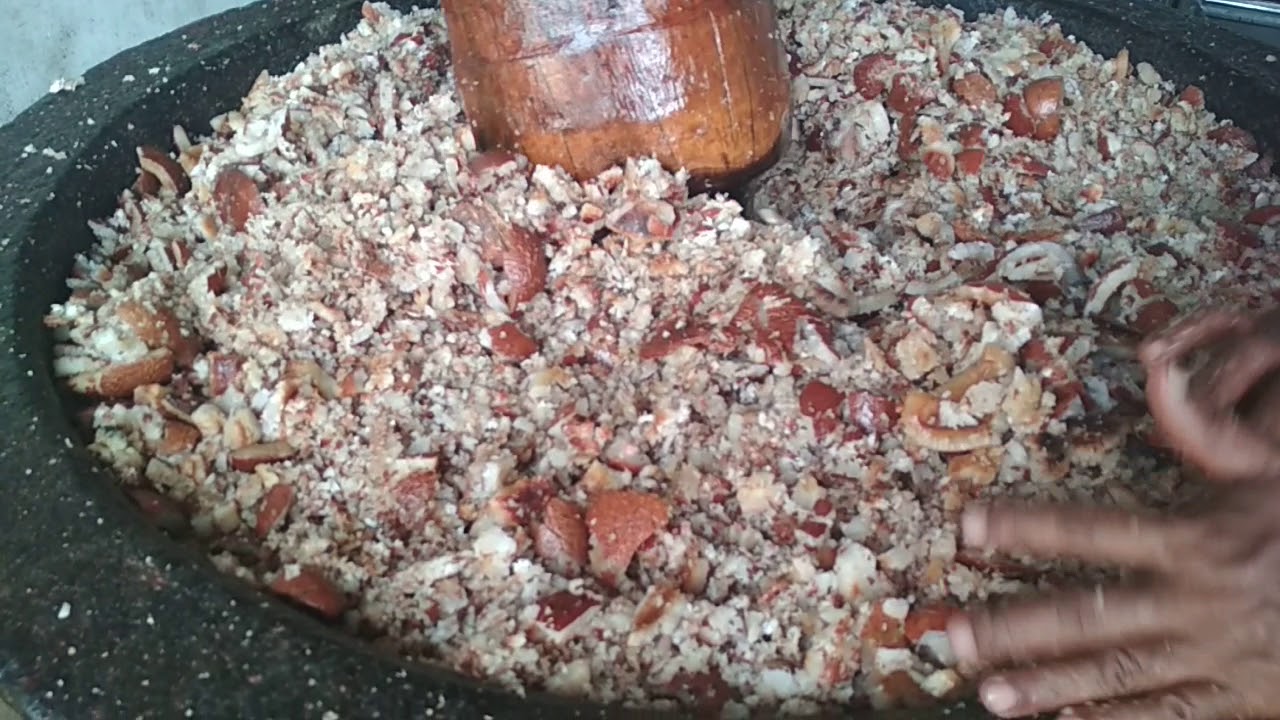 COCONUT PRESSING IN STONE CHEKKU - YouTube