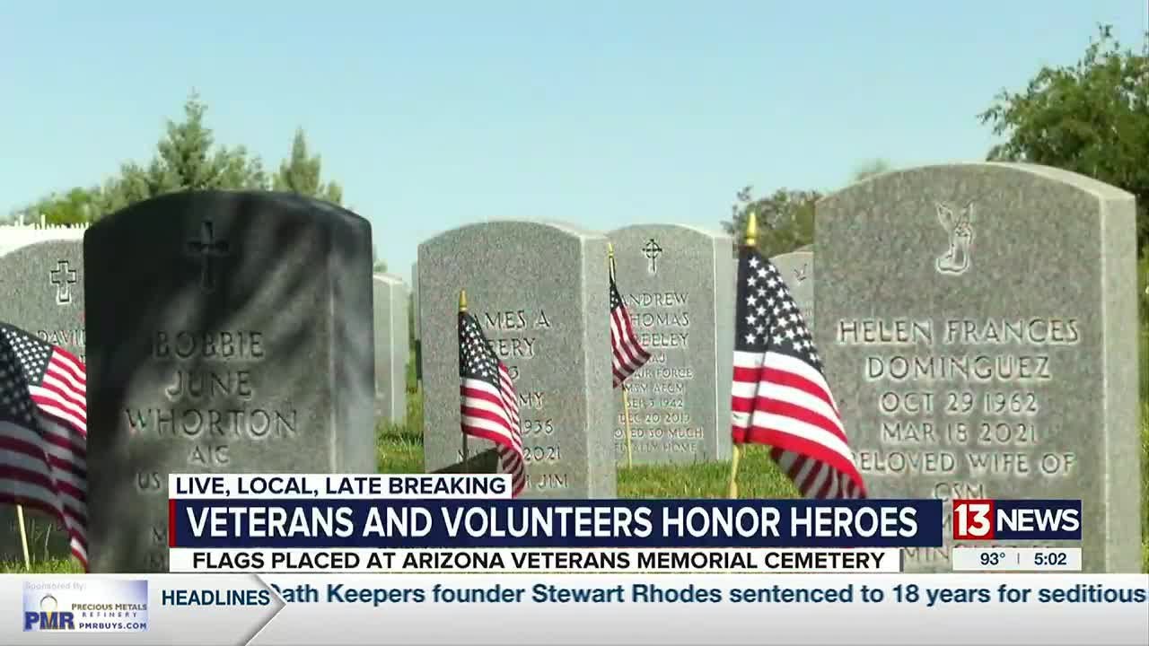 Veterans, volunteers and active duty place flags on markings at Arizona ...