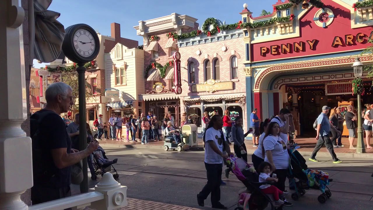 Disneyland people watching on the Main Street porch - YouTube