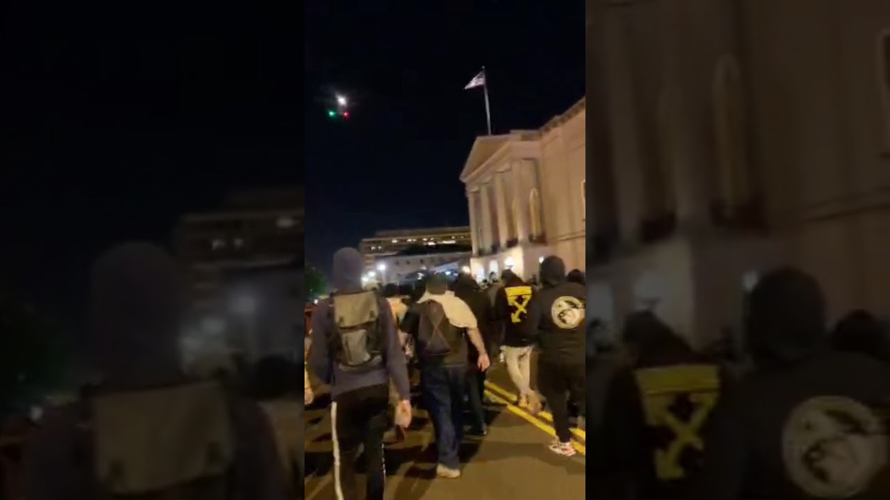 Red Cross military helicopters flying low over demonstrators in ...