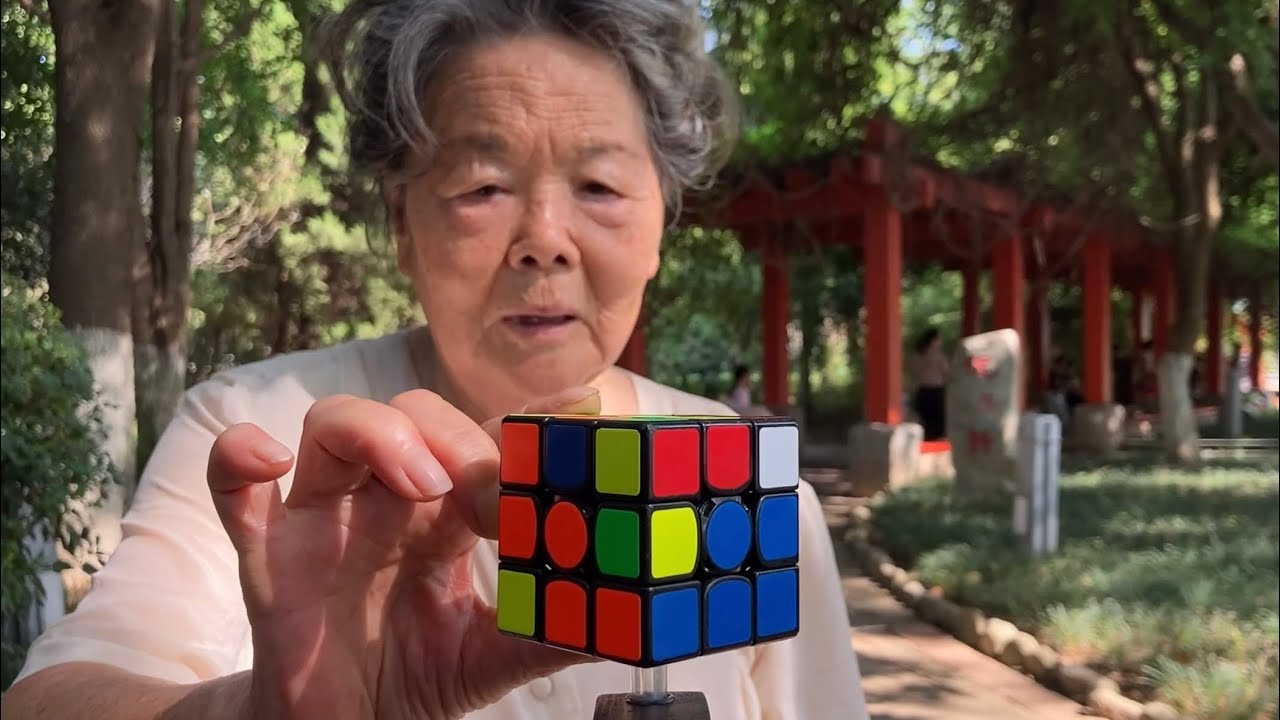 One person turns one step until the Rubik's cube is restored.# ...