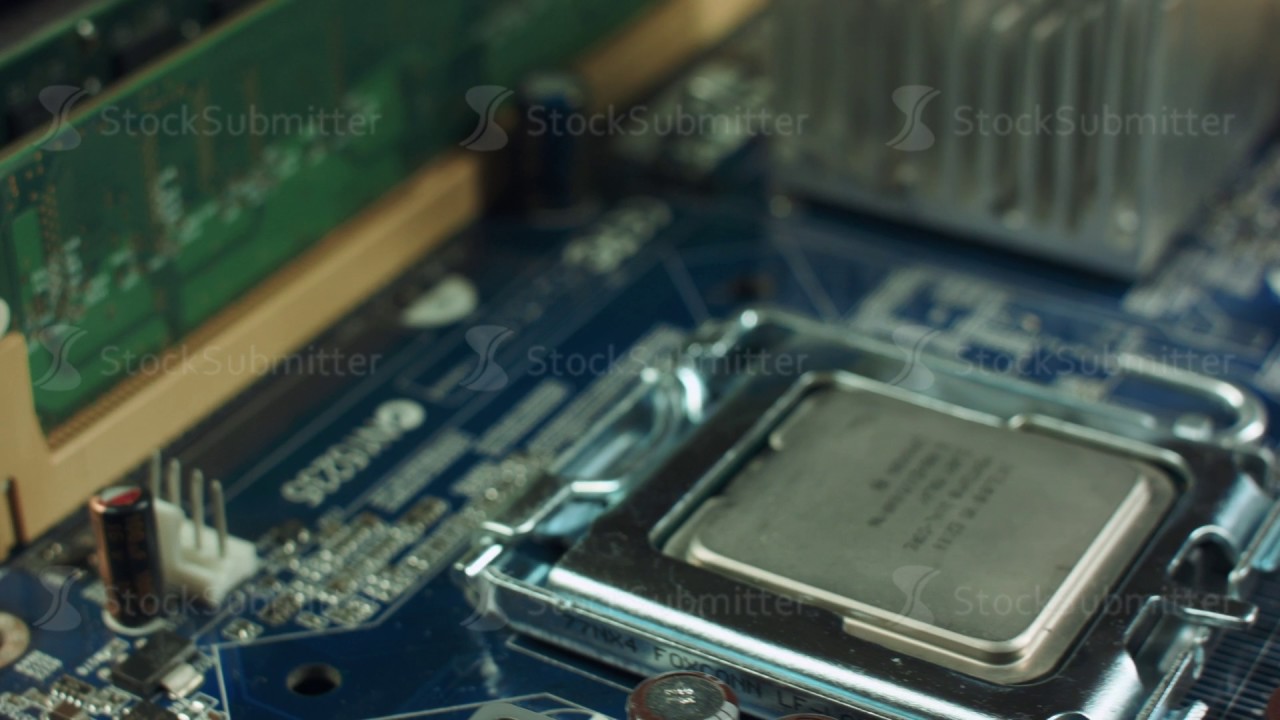 motherboard with RAM spinning on the stand, slot for memory closeup ...