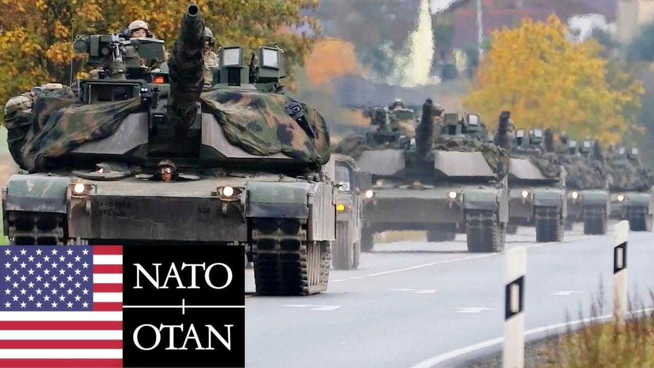 US Army, NATO. M1A2 Abrams tanks during a tactical road march in ...