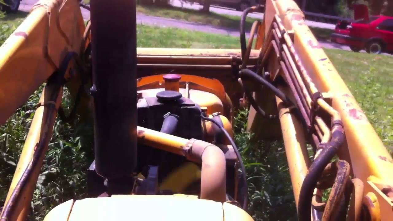 John Deere 300B first start and move of the year - YouTube