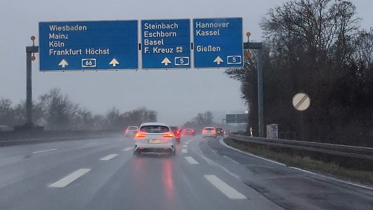 a drive in rain from Frankfurt city to Steinbach over highway/Autobahn ...