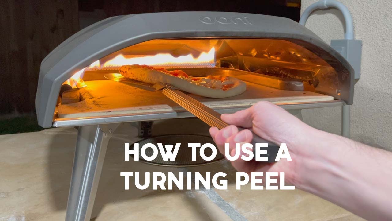 How to use turning peel on a Ooni oven. - YouTube