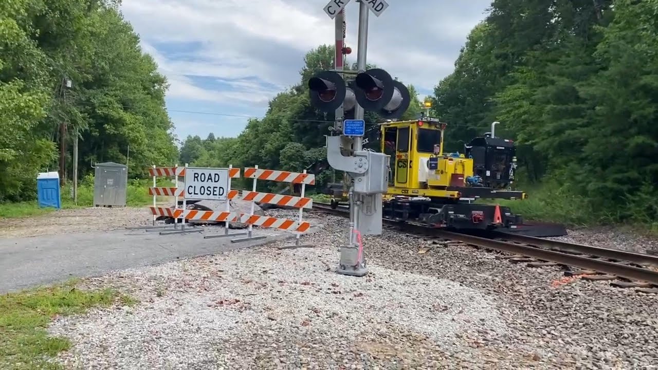 A close up look at CSX MOW track gang replacing ties, plates, spikes ...