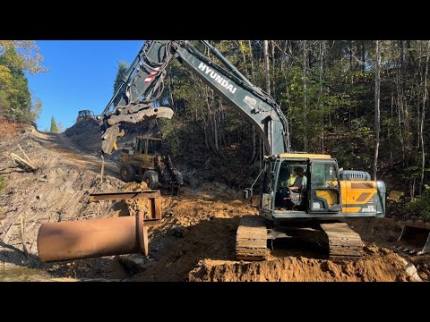 Installing The Overflow And Rock On The Abandon Quarry Dam - YouTube