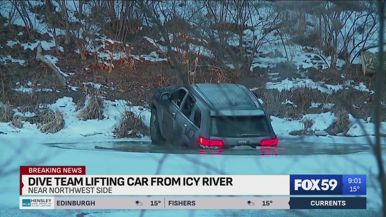 SUV plunges into water after attempted recovery - YouTube