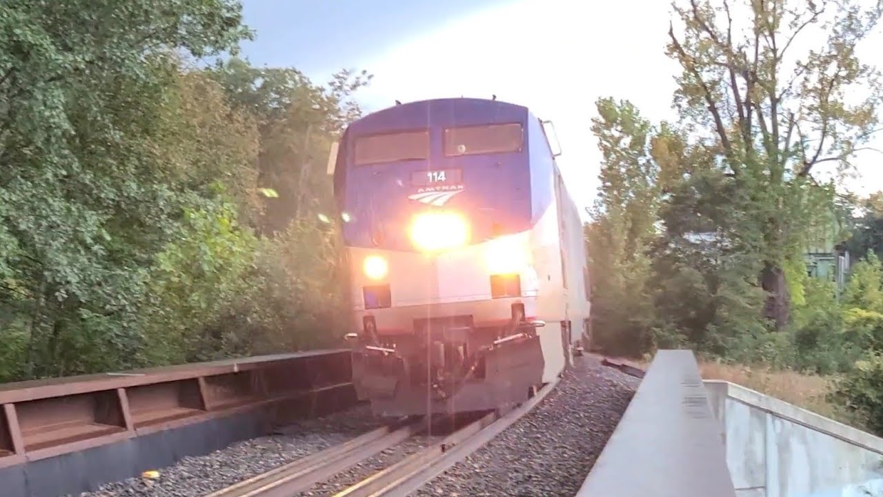Amtrak #114 on Vermonter going over a rusty bridge in the rain. - YouTube