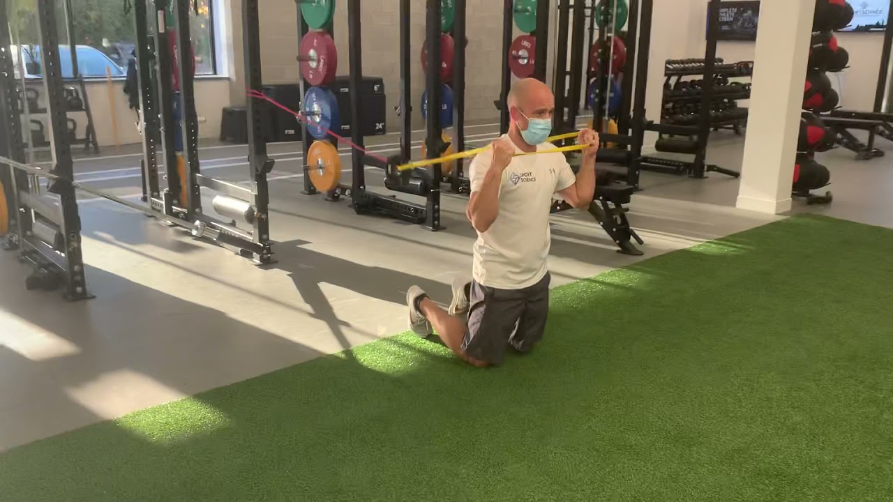 Tall kneeling overhead anti extension press vs perturbation - YouTube