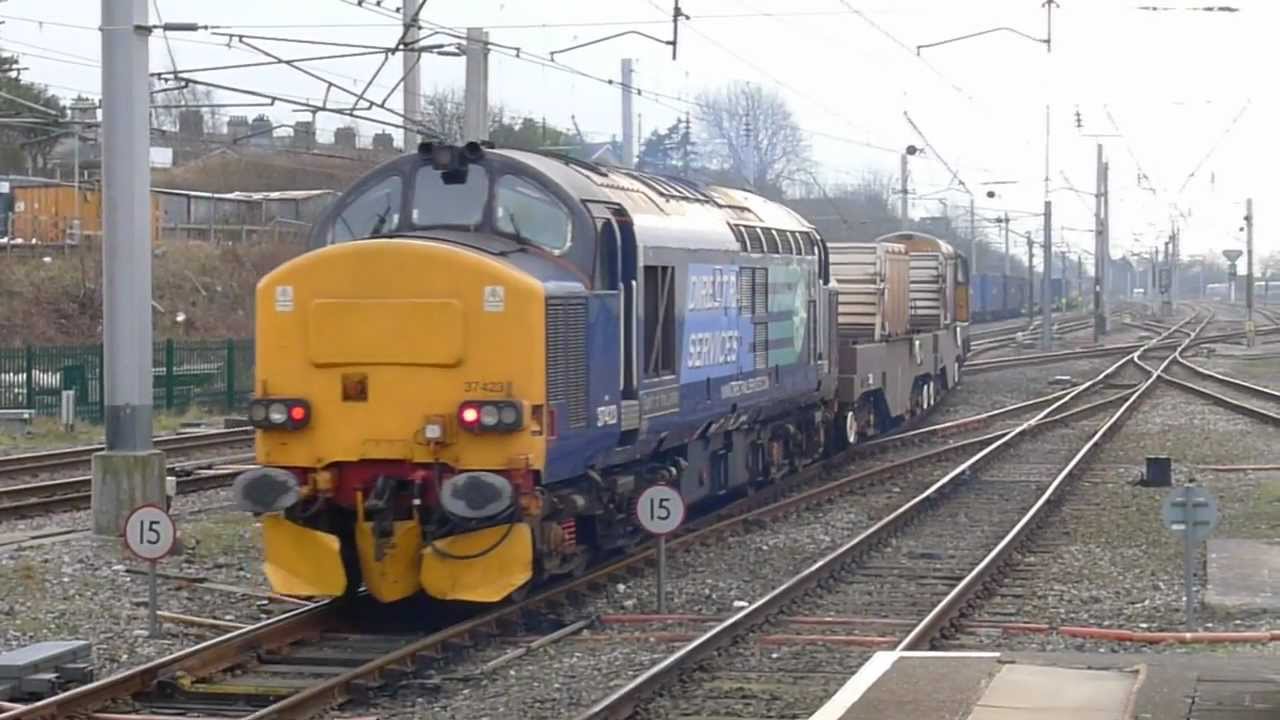 DRS class 20. 20303 with 37423 departing Carnforth on 6C51 Heysham 31st ...