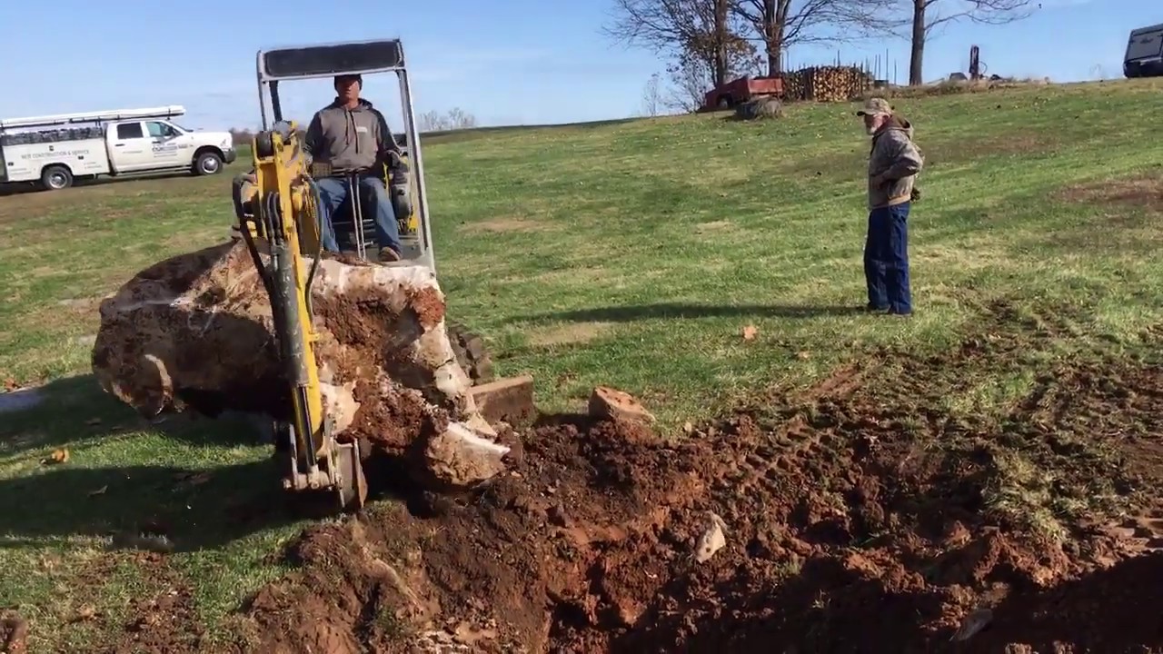 Mustang ME3003 Excavator vs. Big Rock - YouTube