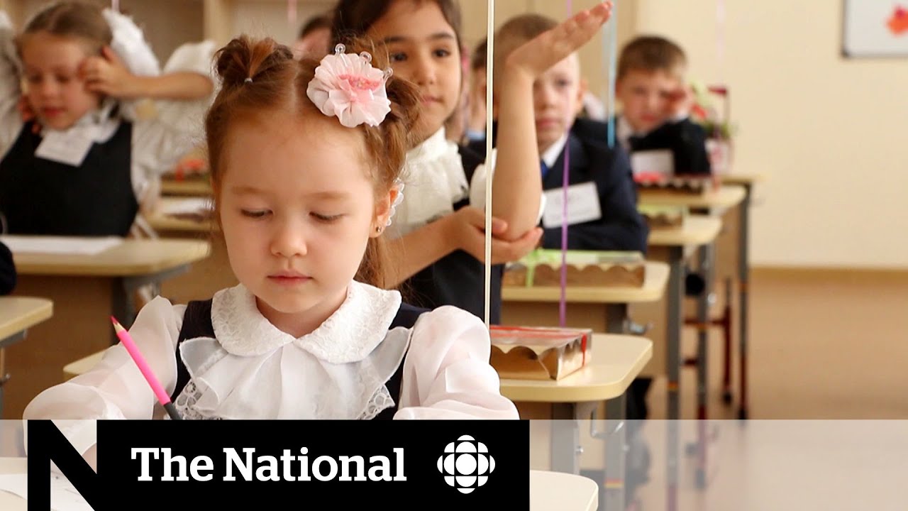 Russian students head back to school with heat sensors, sanitizing ...