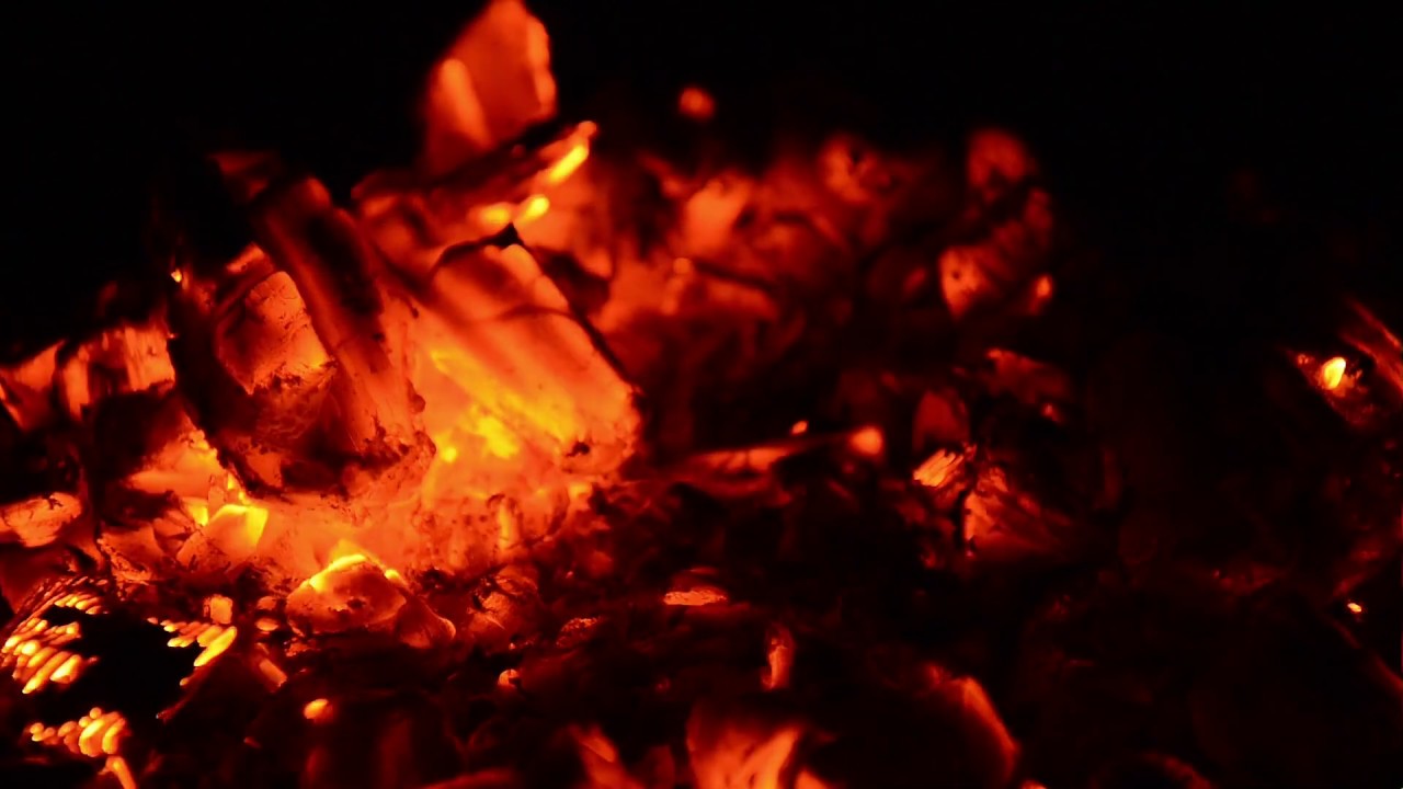 Embers and ashes of mighty big fireplace ablaze Fanning campfire embers ...