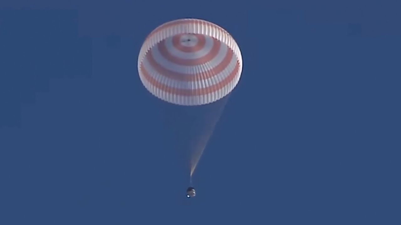 Touchdown! Soyuz spacecraft carrying record-breaking crew lands in ...