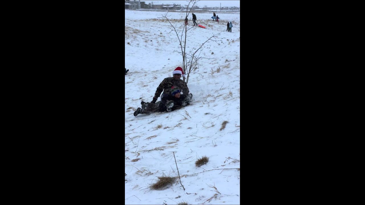 Dad and son sledding into a tree - YouTube