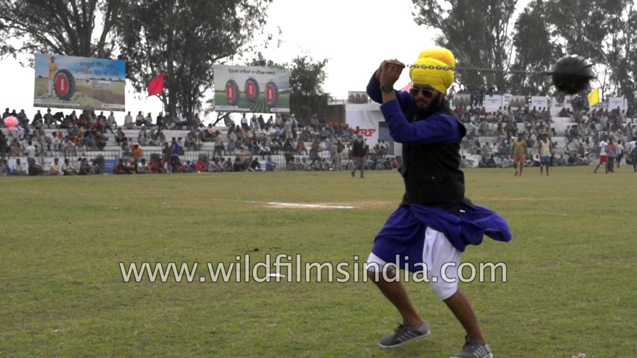Nihang sikh rotates spike wrecking ball in slow motion - YouTube