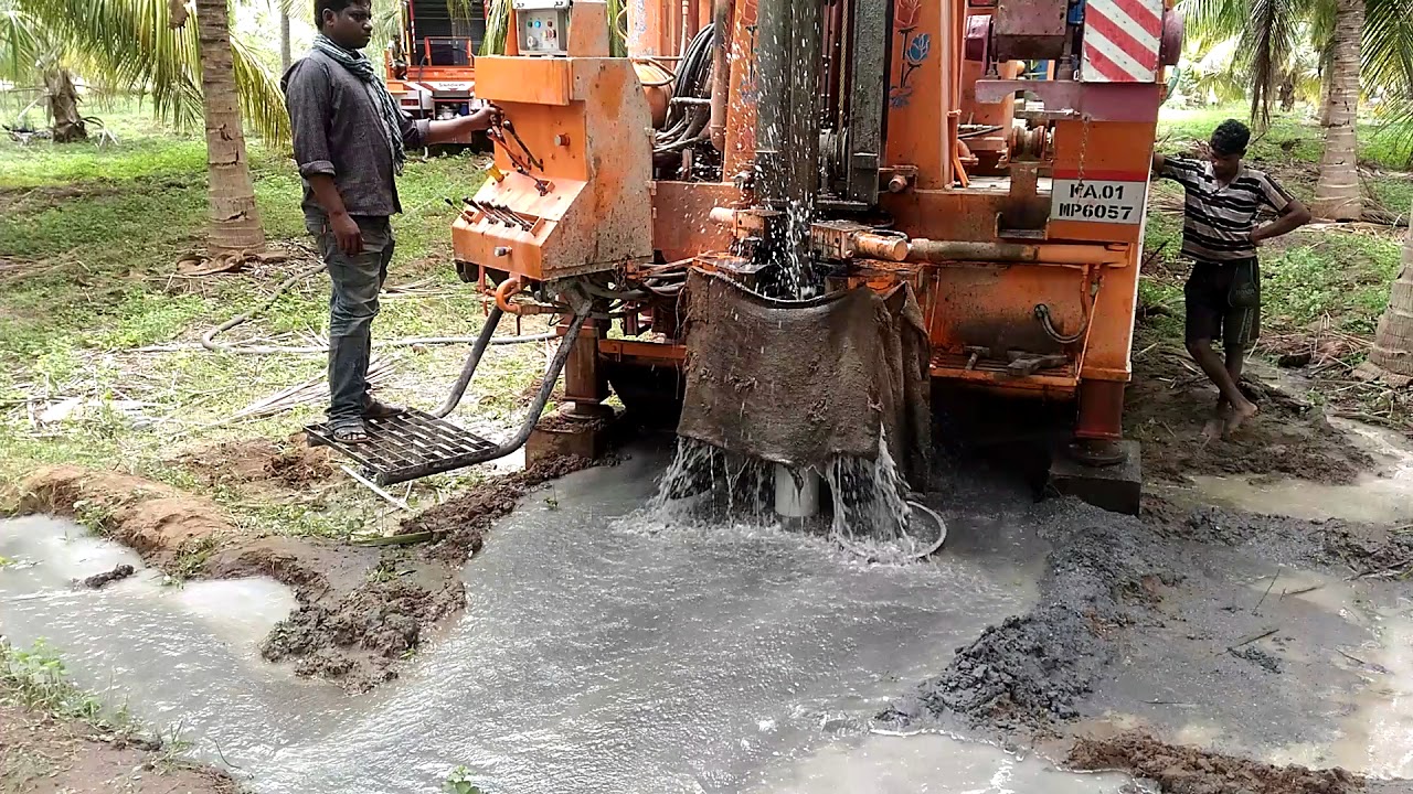 Flushing the borewell using atlas copco XRV1200 compressor - YouTube