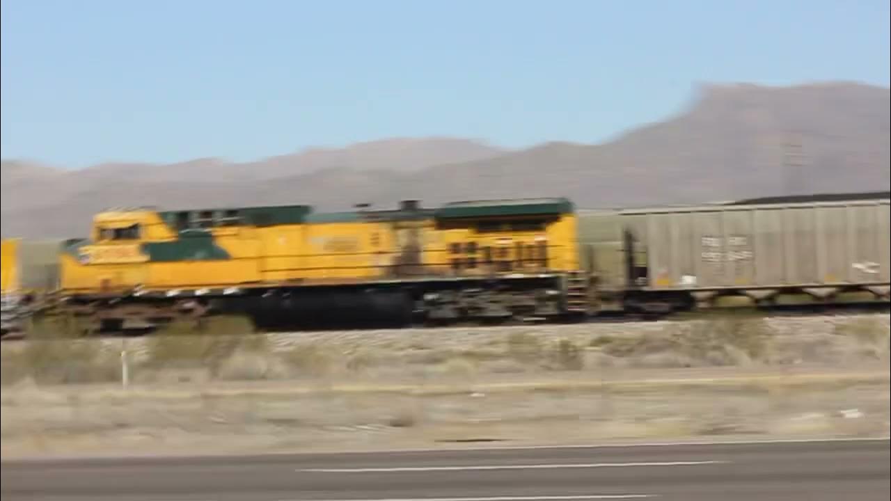Eastbound Union Pacific coal train with UP ex CNW # 6706 on I-10 - YouTube