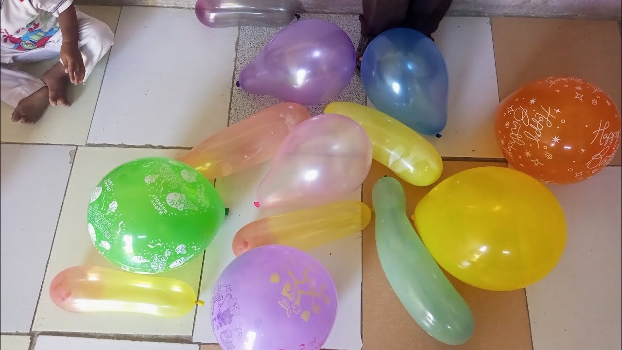Children's game of popping balloons with feet @balloonsongs - YouTube