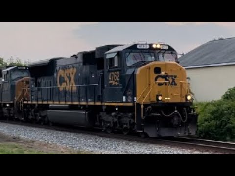 CSX Freight Train. 2 Engines/ 110 Rail Cars. Lead Engine # 4762 is a freshly painted 03 EMD SD70 ...