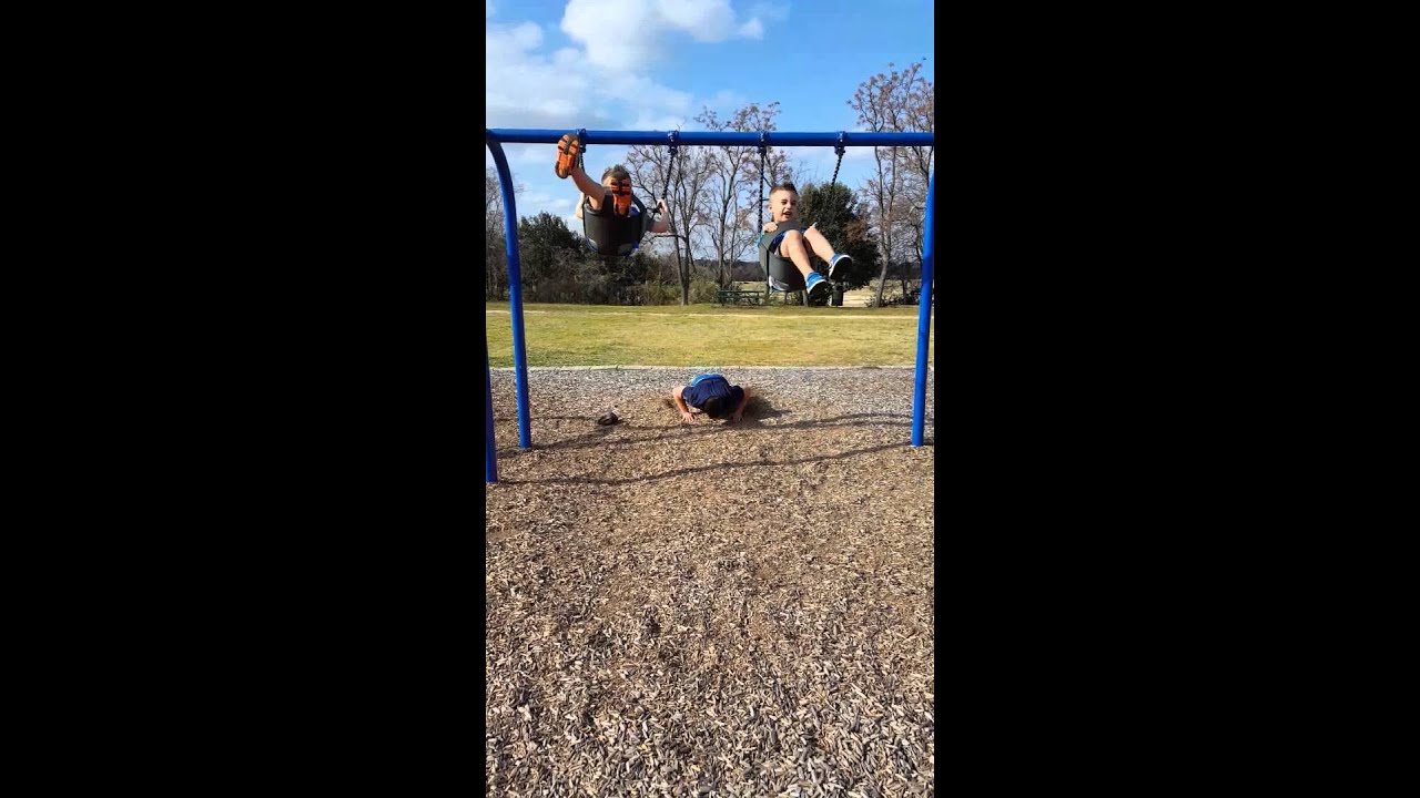 Dad doing burpees while swinging kids at park! - YouTube