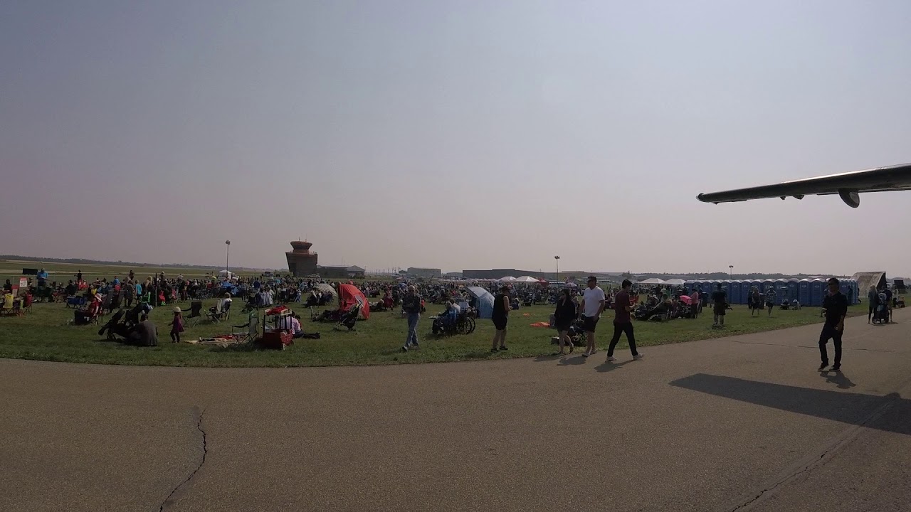 View of the crowd and Villeneuve Airport control tower at 2018 Edmonton ...