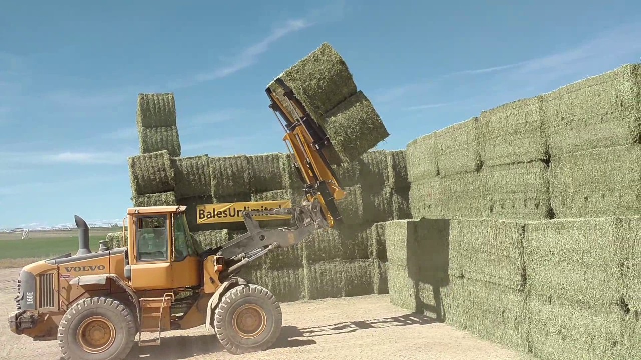 Bales Unlimited ExtendaFork stacking and retrieving 6 bales high - YouTube