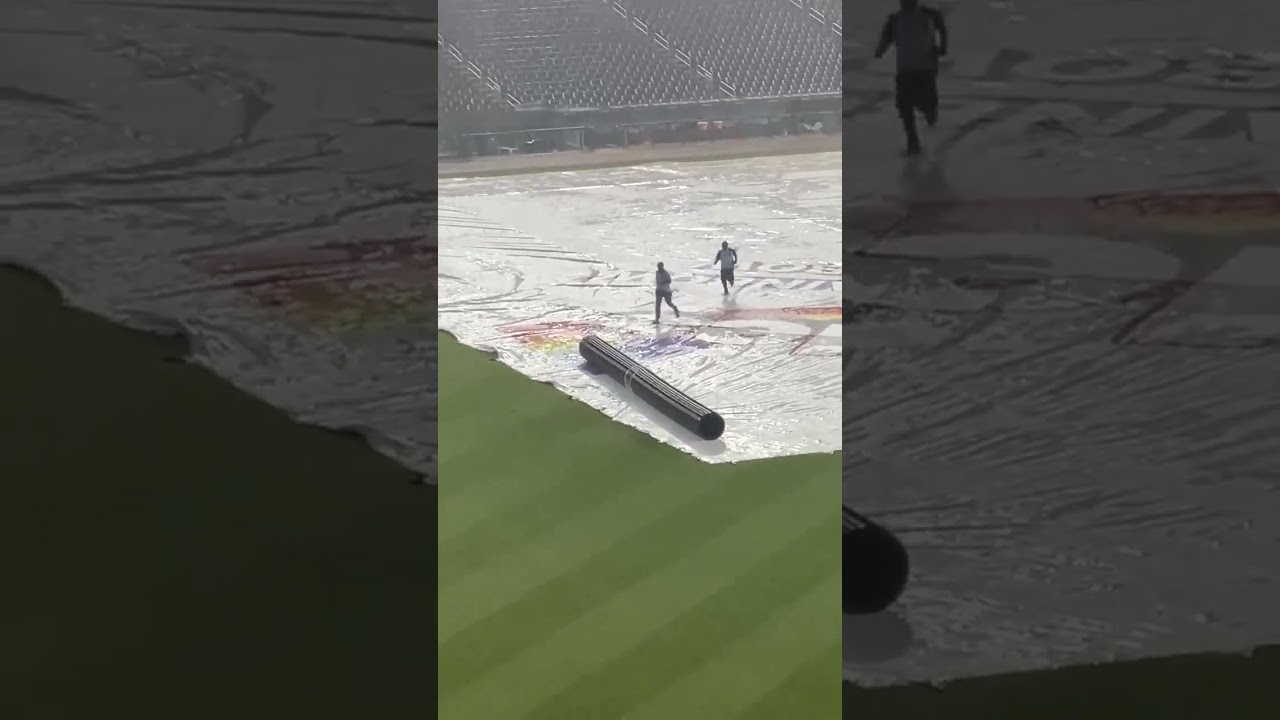 Fan on the field streaking during rain delay and does slip and slide ...