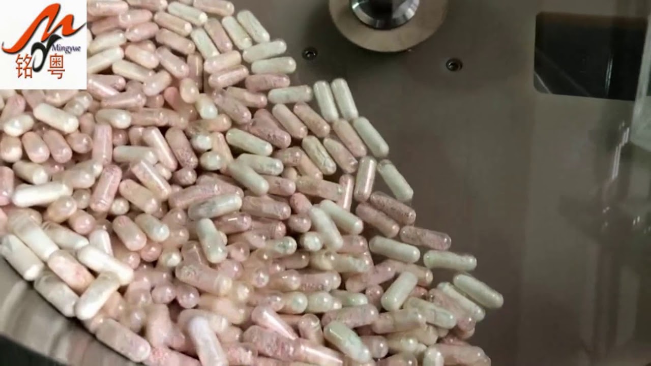 capsule sachet packing machine four side sealing with euro hole - YouTube