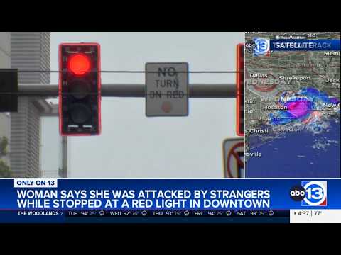Woman says she was attacked in her car while stopped at a red light in downtown Houston