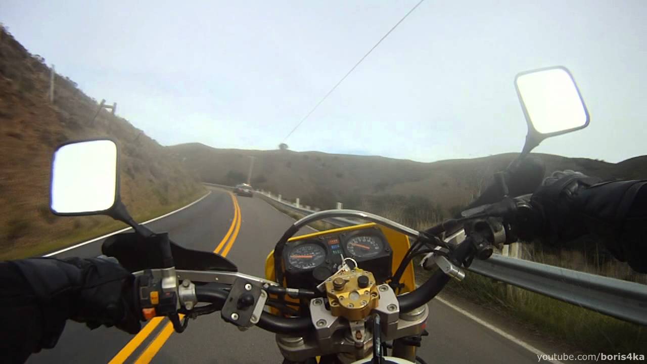 Car overtakes motorcycle in front of cop, gets pulled over - YouTube