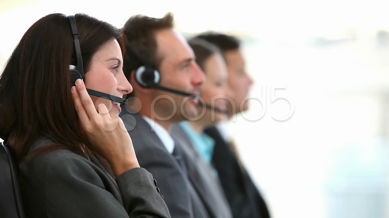 Smiling Customer Service Agents Working In A Call Center. Stock Footage ...