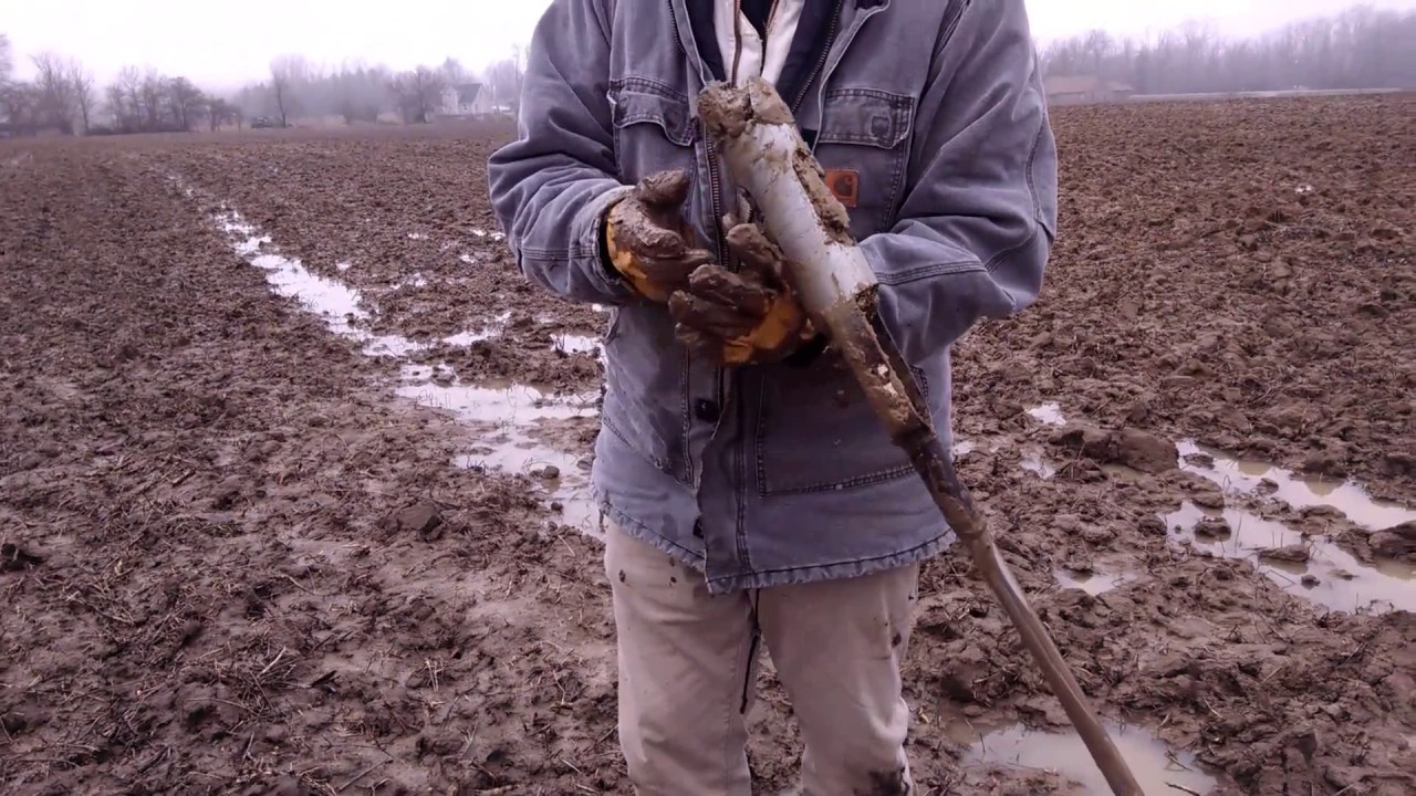 soil boring in a muddy field - YouTube