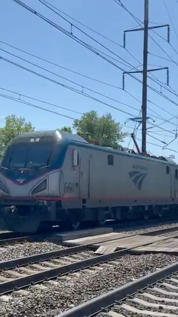 Amtrak 660 ACS-64 leads Amtrak 82 through Jersey Ave with a shave and a ...