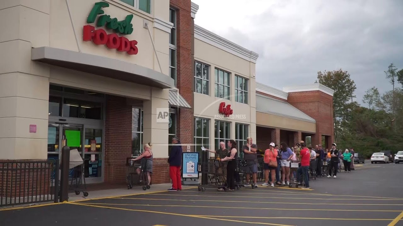 People line up outside North Carolina grocery store post Helene - YouTube