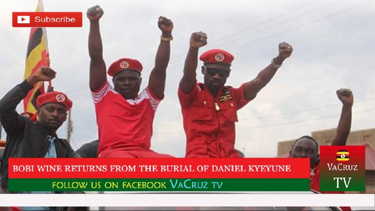 Police waves at Bobi wine as he returns from the burial of Daniel ...