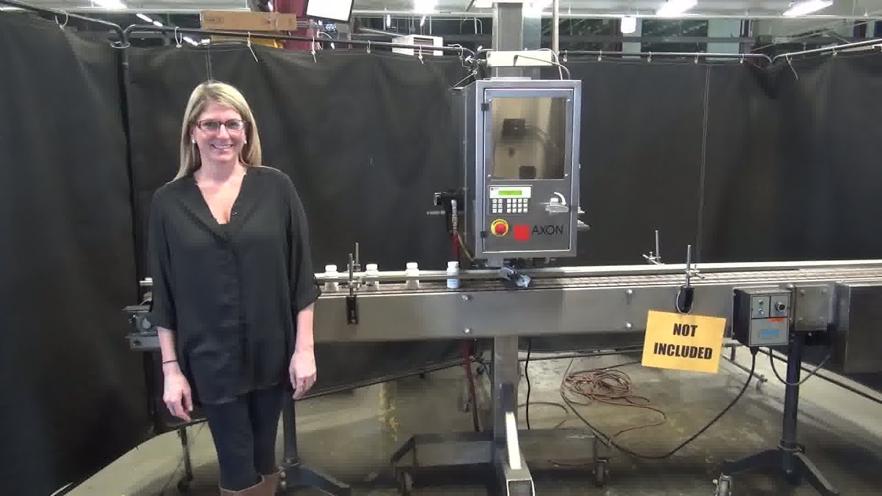 Axon EZ-100 Automatic Tamper Evident Shrink Neck Bander Demonstration ...