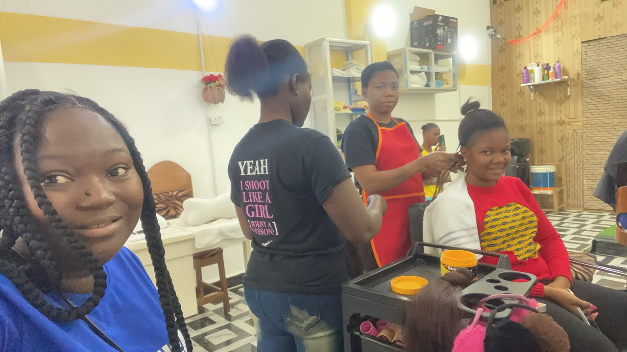 Liberian girl Braiding her hair in Liberia - YouTube