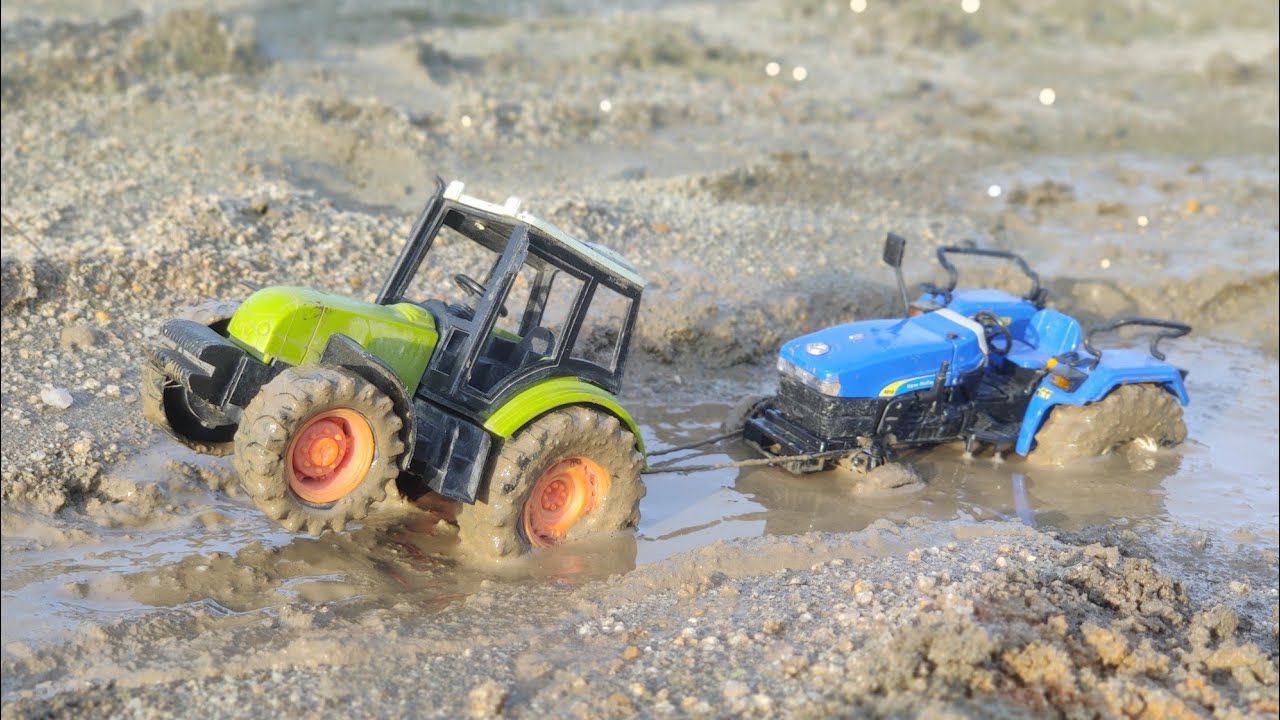 New holland tractor stuck in heavy mud rescue by new tractor | tractor ...