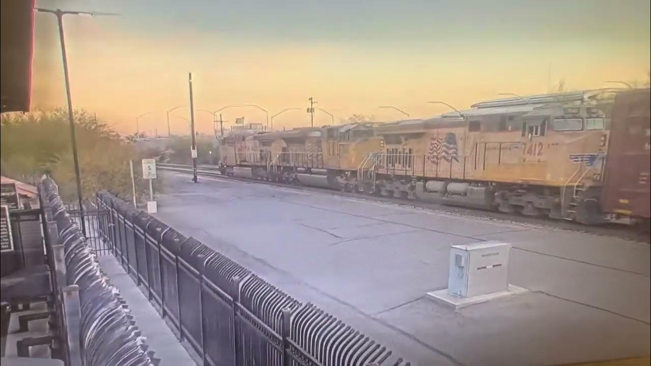 UP 5758 leads a train past the Tucson Az virtual railfan up sunset subdivision camera on Feb8th ...