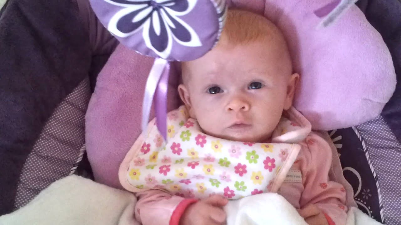 Newborn Baby Girl Following Her Mobile In Her Swing - YouTube